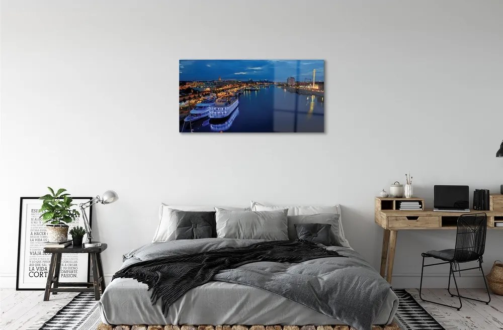 Obraz na skle Loď moře město na noční obloze 140x70 cm