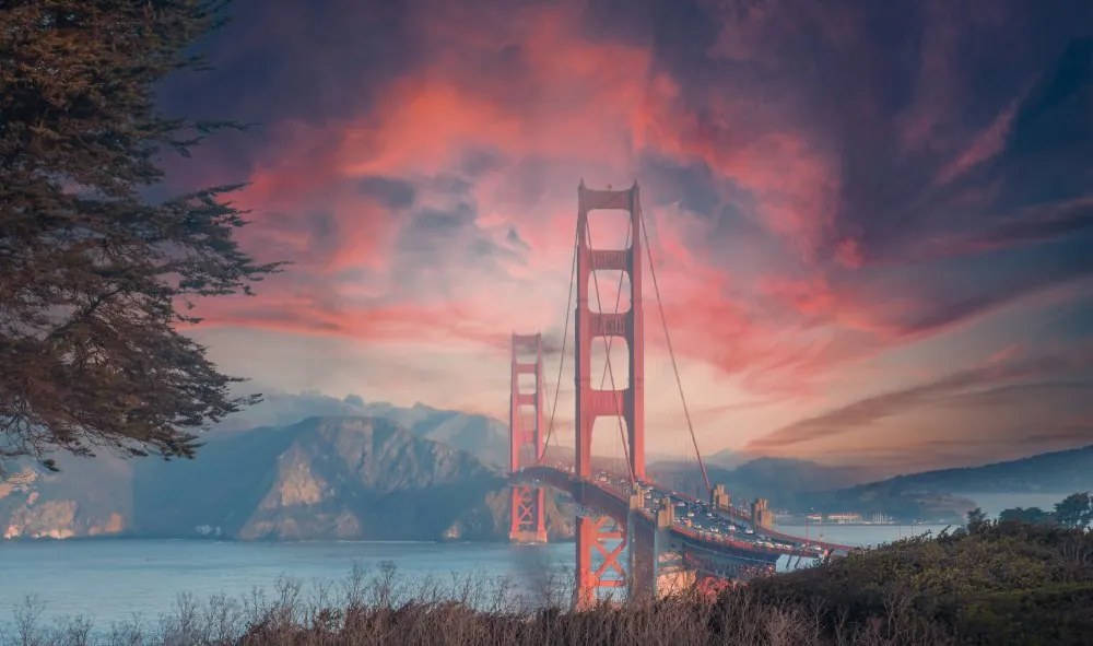 Fototapeta Beautiful View Of Golden Gate Bridge In Background Of Mountains During Sunset Hladký vinyl 416x254