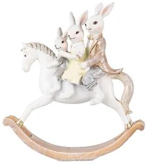 Dekorativní figurka rodiny králíků na houpacím koníkovi