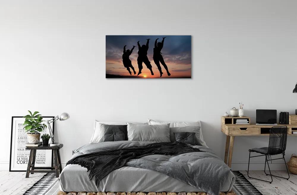 Obrazy na plátně Lidé mraky západ 120x60 cm