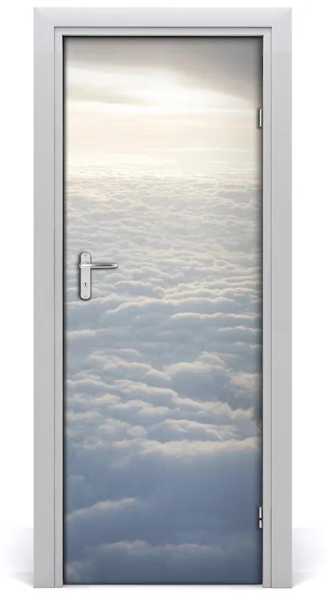 Fototapeta na dveře let nad mraky 95x205 cm