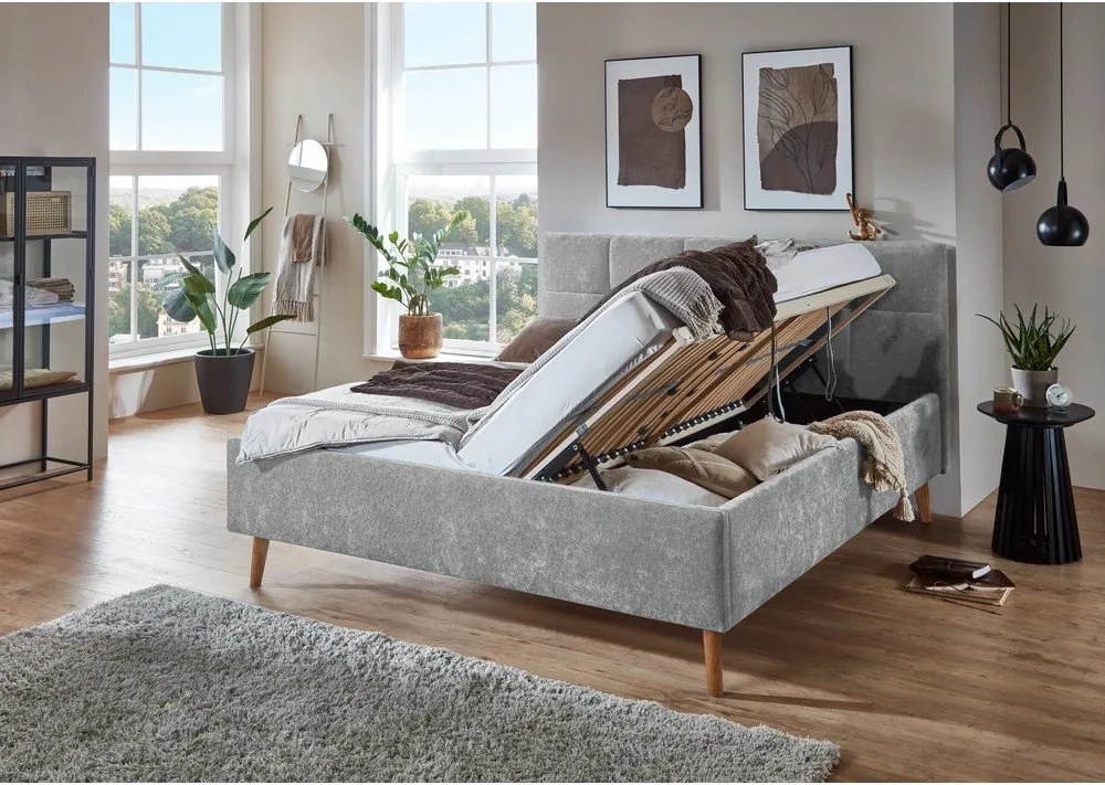 Šedá čalouněná dvoulůžková postel s úložným prostorem s roštem 180x200 cm Nova – Meise Möbel