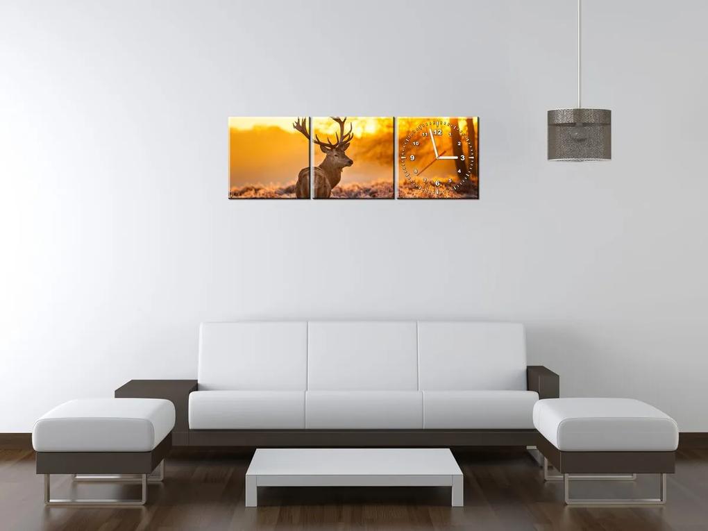 Gario Obraz s hodinami Silný jelen - 3 dílný Rozměry: 90 x 30 cm