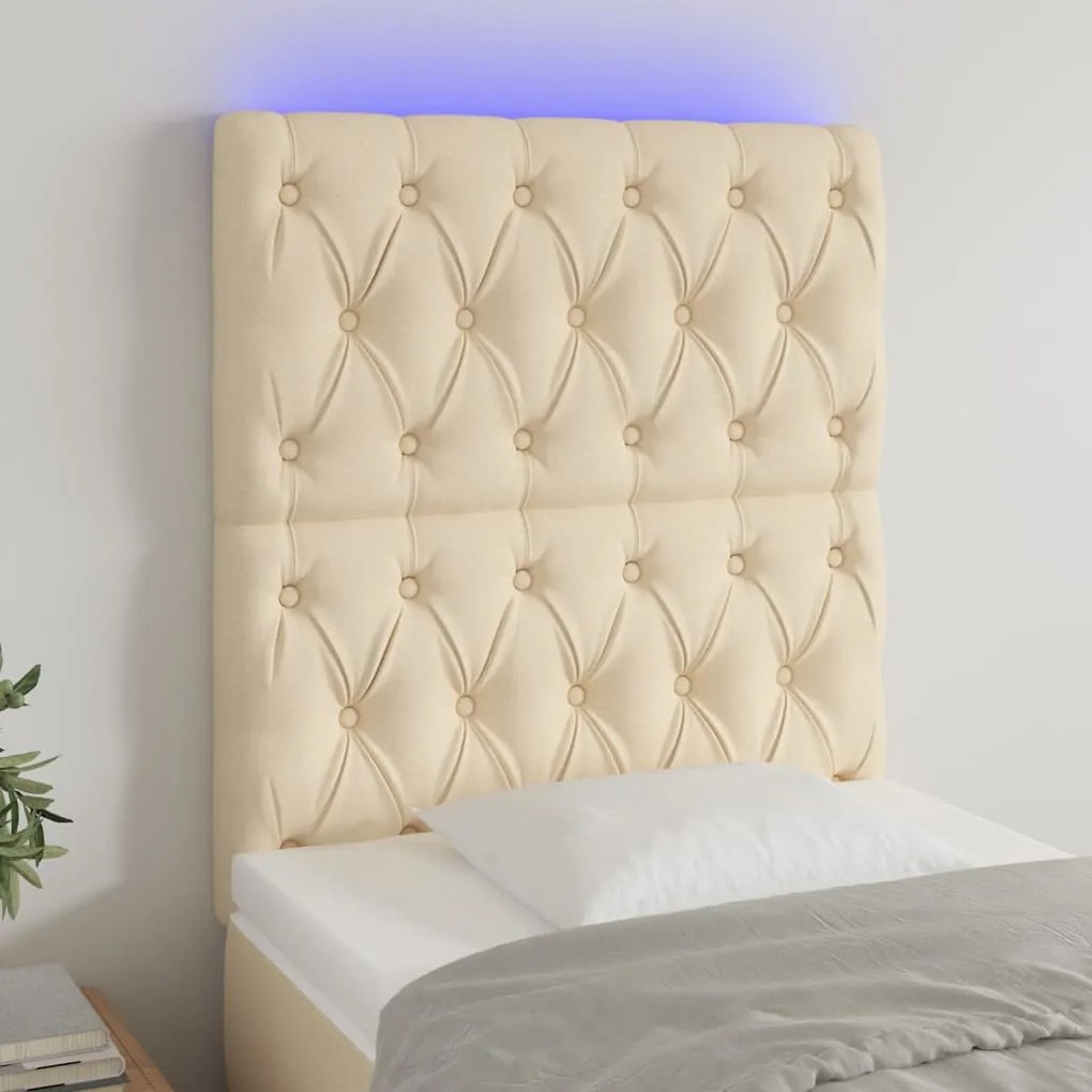 Čelo postele s LED krémové 80x7x118/128 cm textil