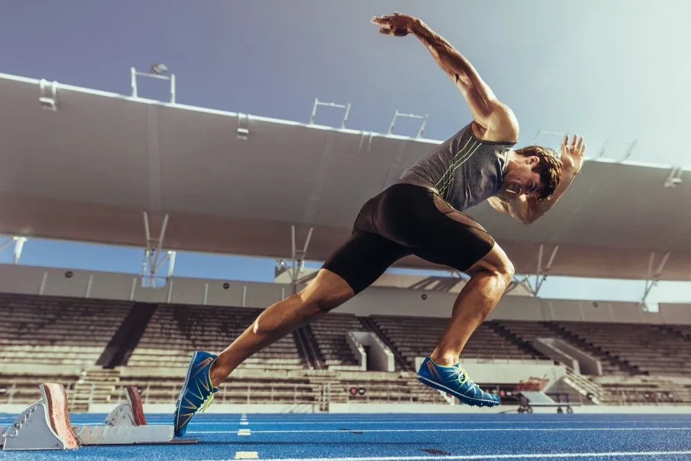 Fototapeta Sprinter Běží Ze Startovacího Bloku Omyvatelný vlies 104x70.5