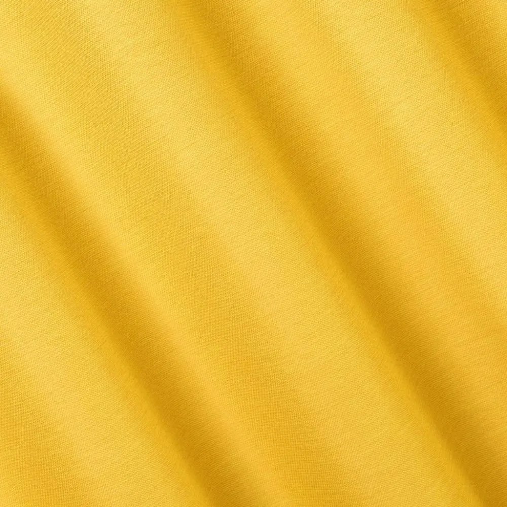 Zářivý zatemňovací závěs do ložnice žluté barvy