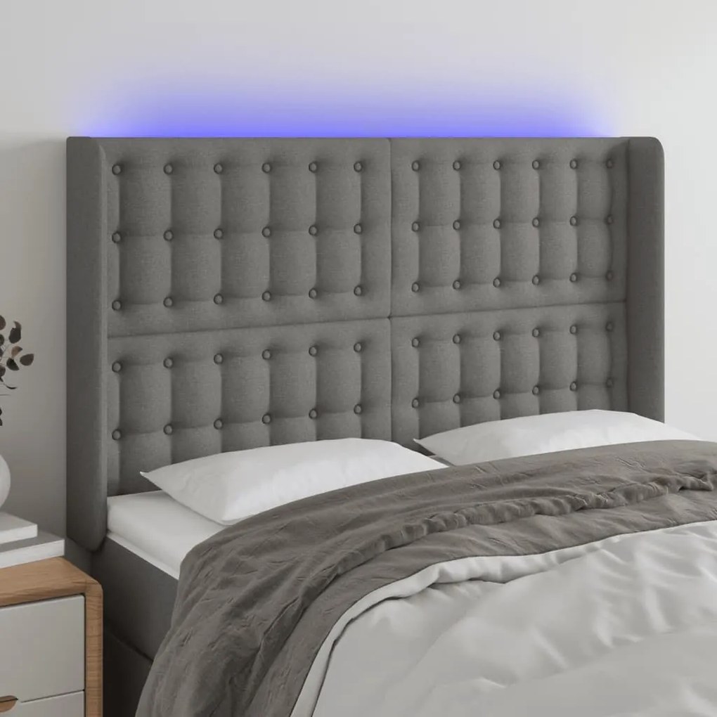 Čelo postele s LED tmavě šedé 147 x 16 x 118/128 cm textil 3124481