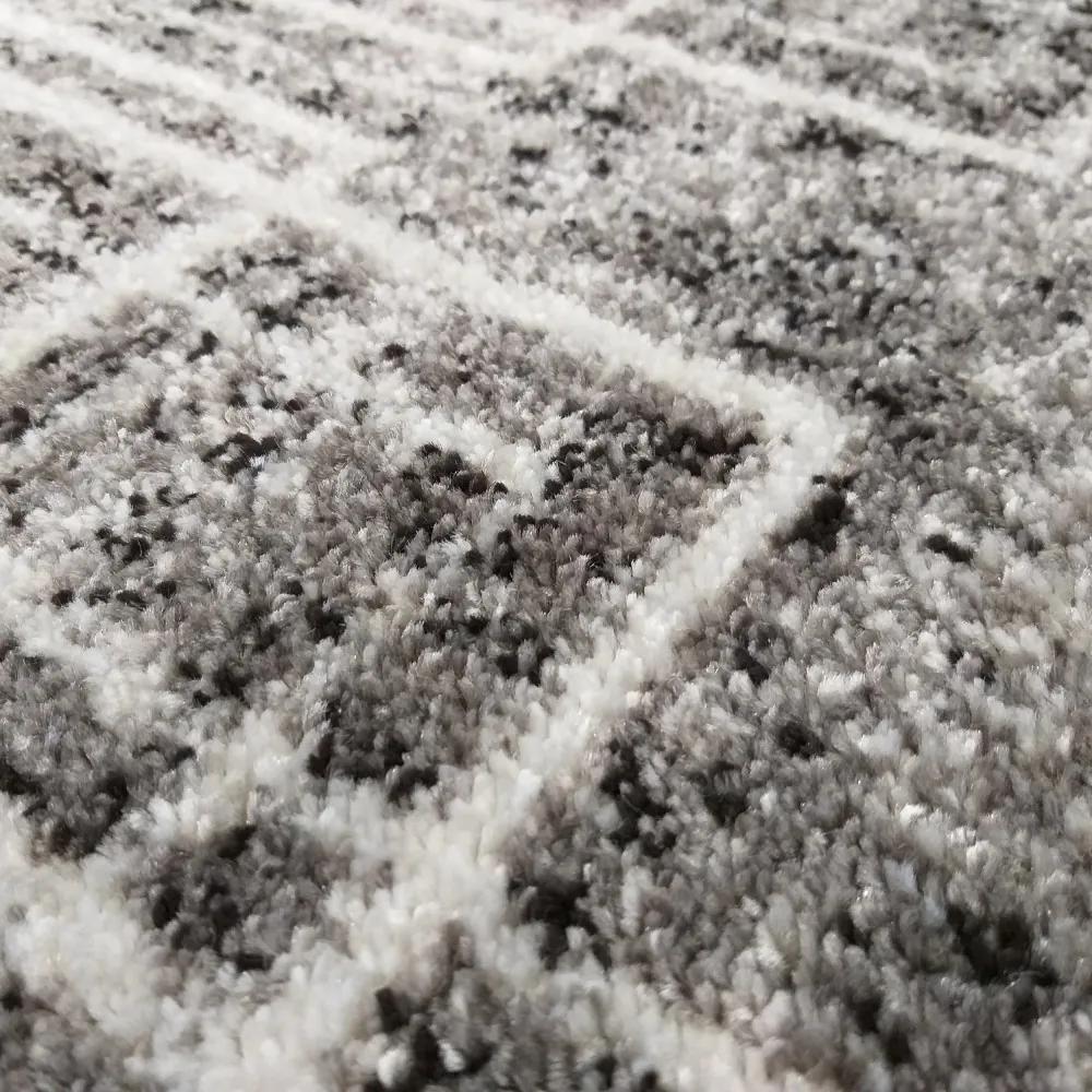Moderní koberec šedé barvy s abstraktním motivem Šířka: 80 cm | Délka: 150 cm