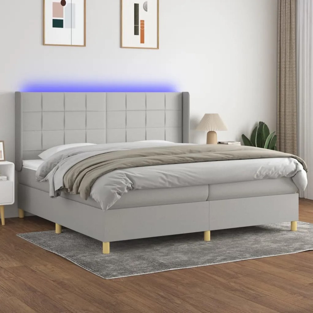 Box spring postel s matrací a LED světle šedá 200x200 cm textil