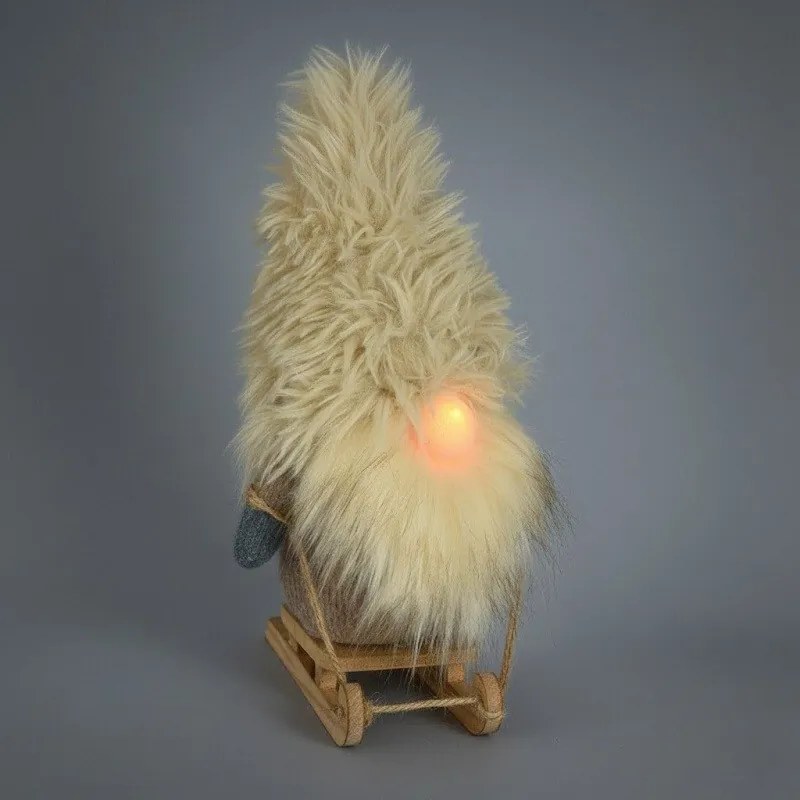 Vánoční skřítek s LED na saních – přírodní 21 cm