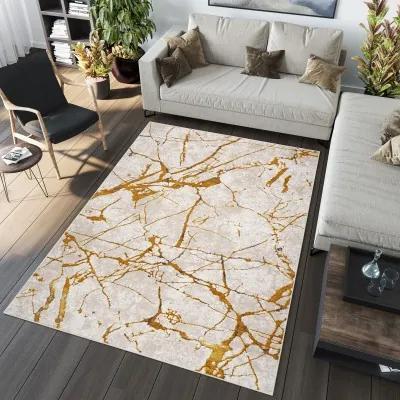 Nadčasový koberec do obývacího pokoje se zlatým motivem Šířka: 140 cm | Délka: 200 cm