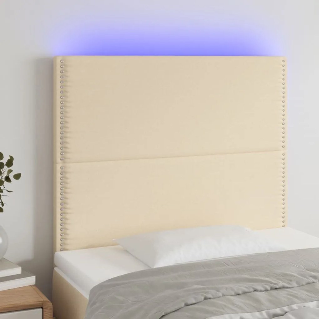 Čelo postele s LED krémové 90x5x118/128 cm textil