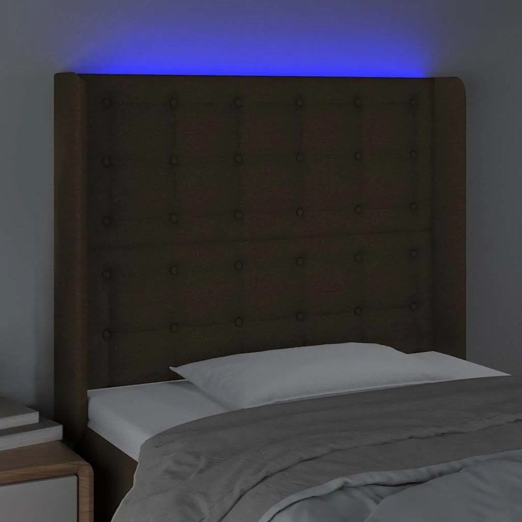 Čelo postele s LED tmavě hnědé 83 x 16 x 118/128 cm textil 3124459