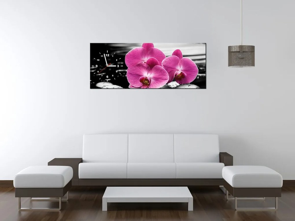 Gario Obraz s hodinami Krásná orchidej mezi kameny Rozměry: 100 x 40 cm