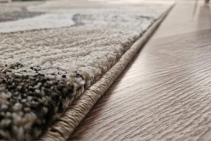 HU Béžovo-hnědý abstraktní koberec Rio 936-Beige-Fume Rozměr: 60x100 cm