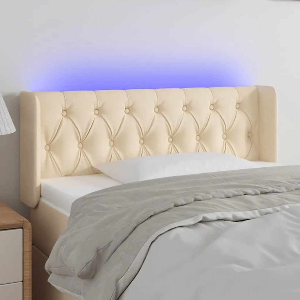 Čelo postele s LED krémové 93 x 16 x 78/88 cm textil