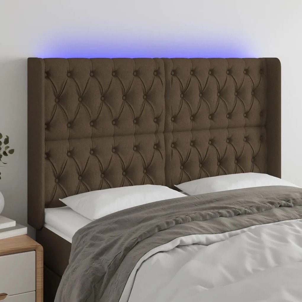 Čelo postele s LED tmavě hnědé 147 x 16 x 118/128 cm textil 3124385