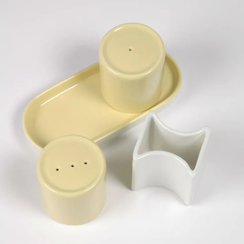 Žlutý porcelánový set slánky a pepřenky Kave Home Midori