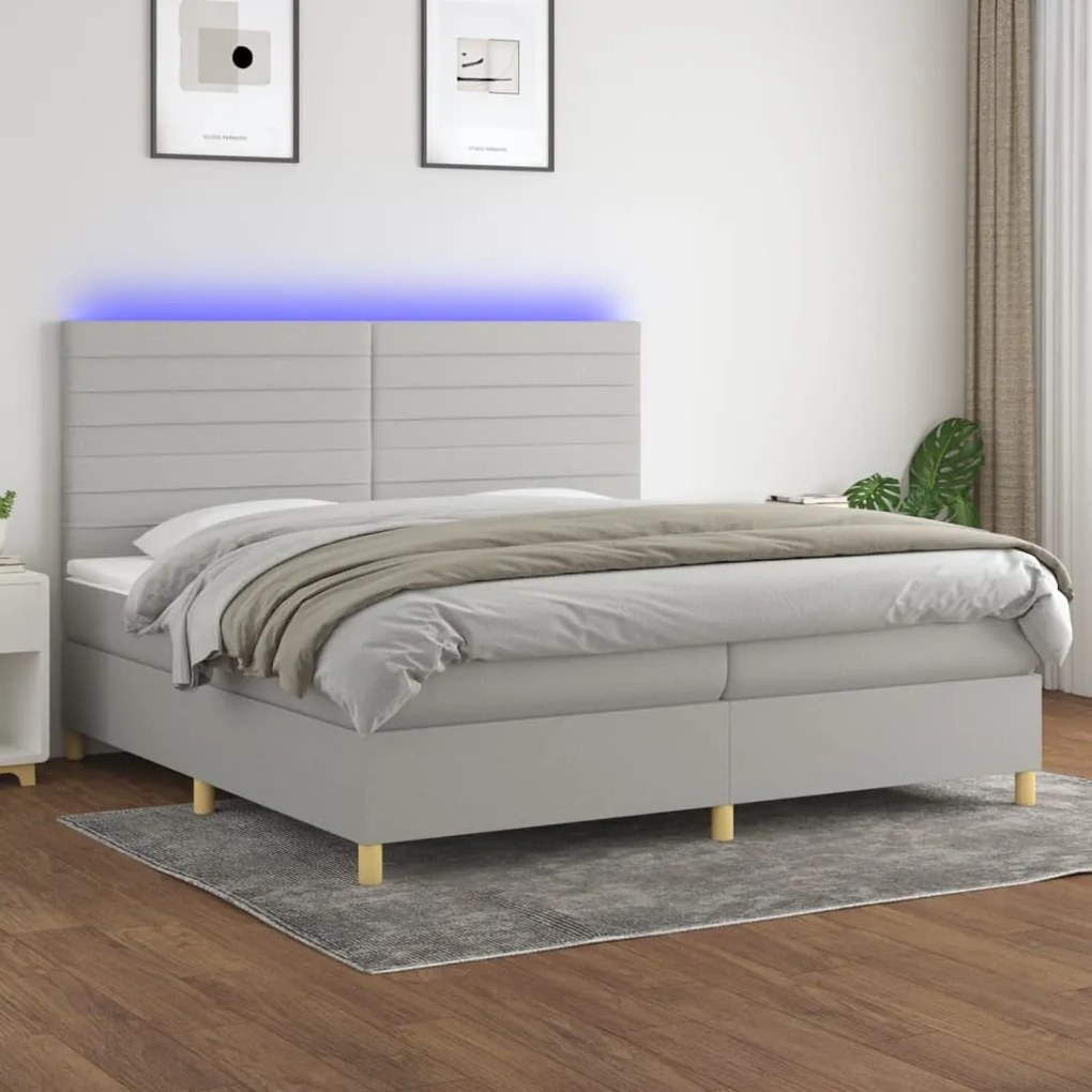 Box spring postel s matrací a LED světle šedá 200x200 cm textil