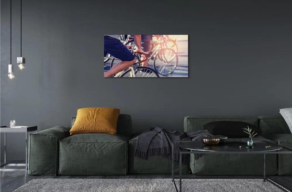 Obraz na skle cyklisté lidí 125x50 cm