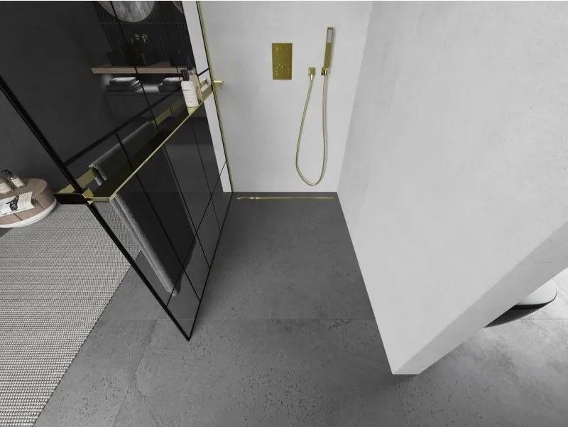 Mexen Kioto+ L, sprchová zástěna Walk-In s poličkou a věšákem 70 x 200 cm, 8mm čiré sklo černý vzor, ​​zlatý lesklý profil, 800-070-123-50-78