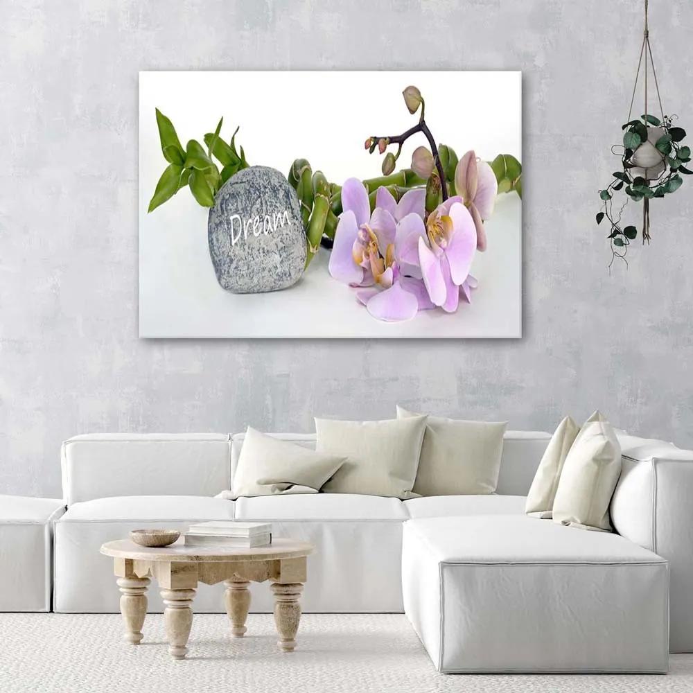 Gario Obraz na plátně Orchideje u kamene s nápisem sen Rozměry: 60 x 40 cm