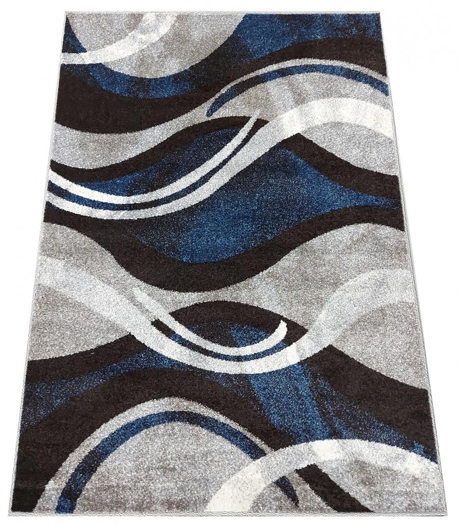 Originální koberec s abstraktním vzorem v modrošedé barvě