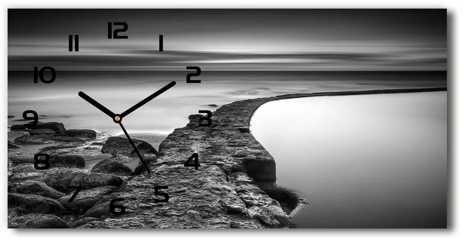 Wallmuralia Skleněné hodiny na stěnu Kamenná pláž 60x30 cm