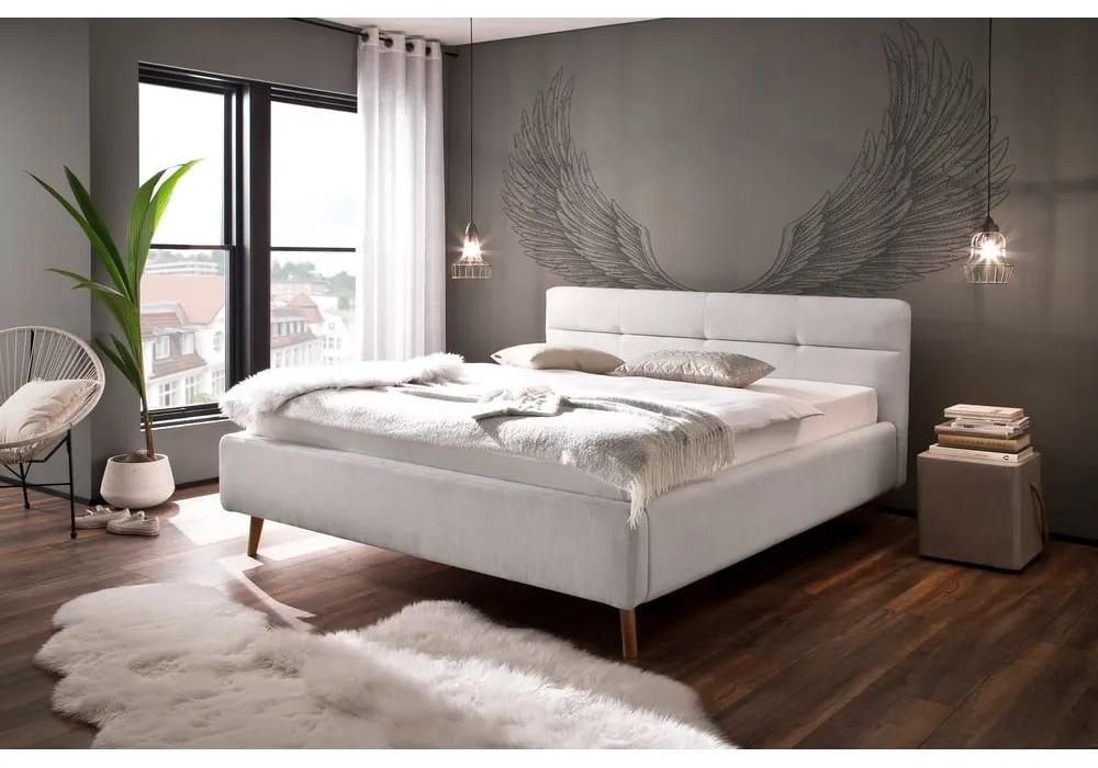 Světle šedá čalouněná dvoulůžková postel s úložným prostorem s roštem 180x200 cm Lotte – Meise Möbel