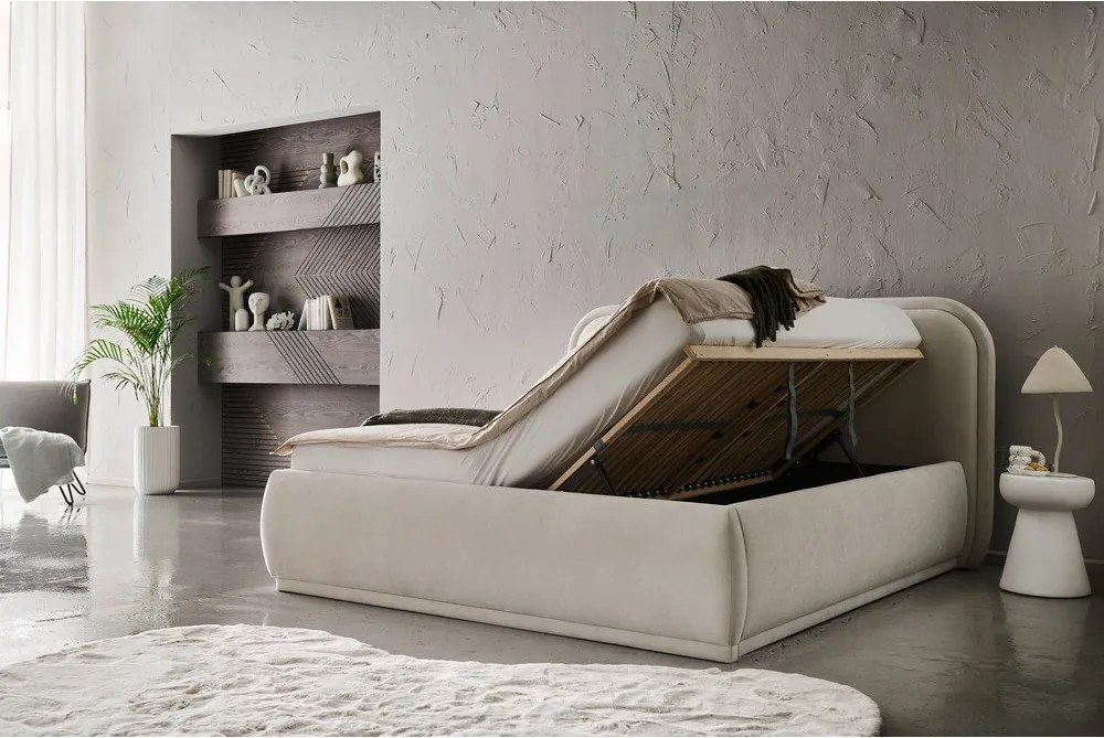 Krémová čalouněná dvoulůžková postel s úložným prostorem s roštem 180x200 cm Soma – Meise Möbel