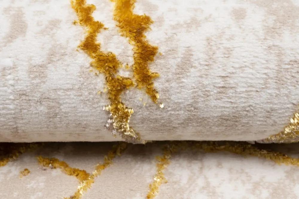Nadčasový koberec do obývacího pokoje se zlatým motivem Šířka: 140 cm | Délka: 200 cm