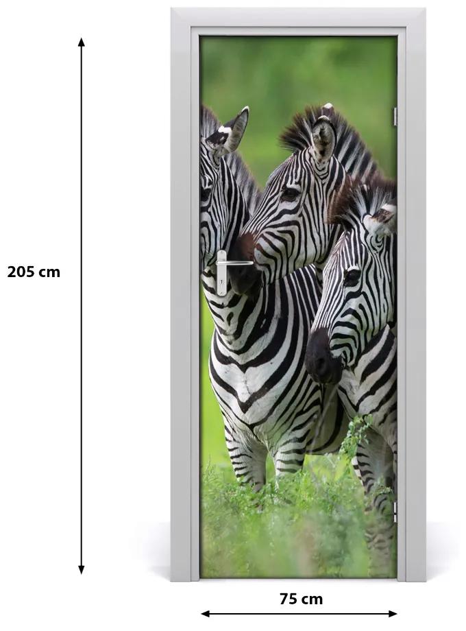 Samolepící fototapeta na dveře Tři zebry 75x205 cm