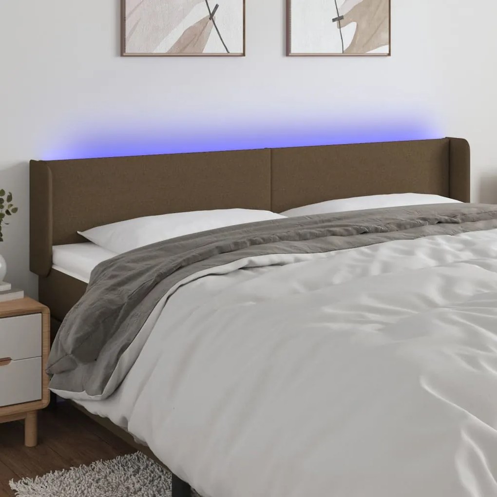 Čelo postele s LED tmavě hnědé 183 x 16 x 78/88 cm textil 3122973
