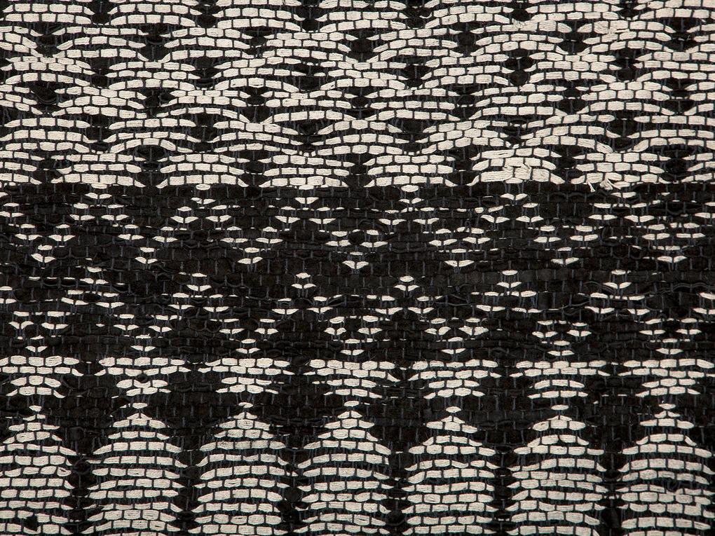 Kožený koberec 140 x 200 cm černý/béžový SOKUN Beliani