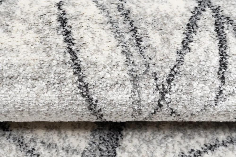Světle krémový moderní koberec s motivem listů Šířka: 80 cm | Délka: 150 cm