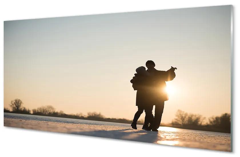 Obraz na skle Lidé tančí v zimě 100x50 cm
