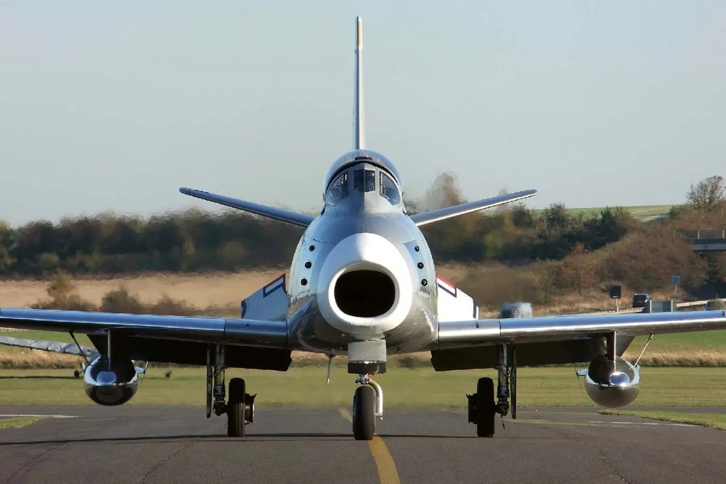 DIMEX | Samolepicí vliesová fototapeta na zeď Rychlé bojové letadlo MA-5-2849 | 375 x 250 cm | zelená, modrá, šedá