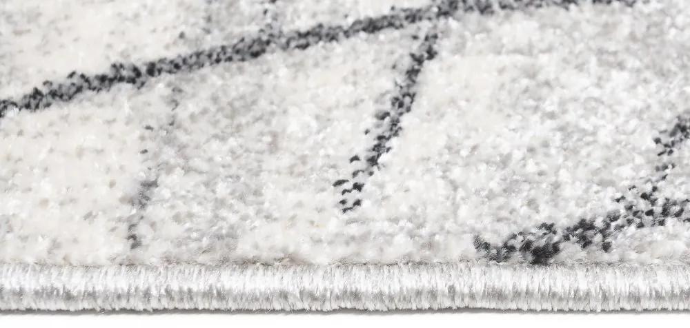 Světle krémový moderní koberec s motivem listů Šířka: 80 cm | Délka: 150 cm