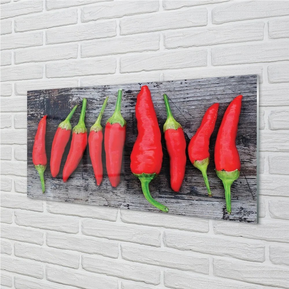 Obraz na skle červené papriky 140x70 cm