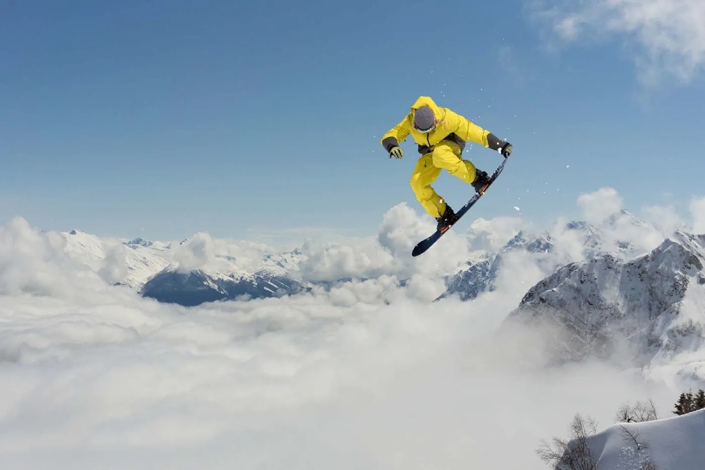 DIMEX | Samolepicí vliesová fototapeta na zeď Skákání snowboardisty MA-5-1574 | 375 x 250 cm | modrá, bílá, černá, žlutá