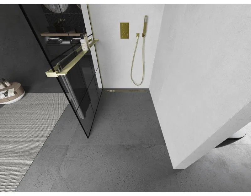Mexen Kioto+, sprchová zástěna Walk-In s poličkou a věšákem 110 x 200 cm, 8mm čiré sklo černý vzor, zlatý matný profil, 800-110-121-55-77
