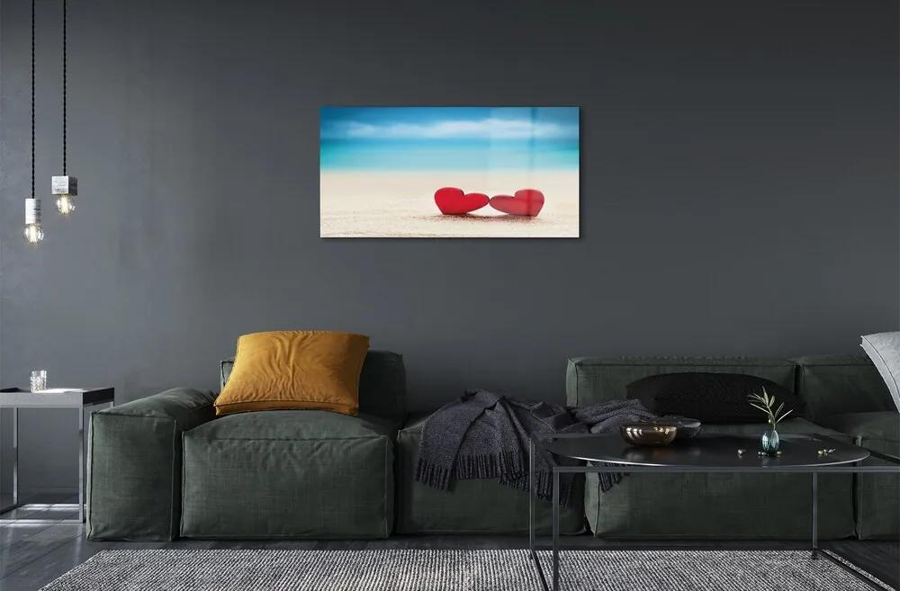 Obraz na skle Srdce červené písečné moře 100x50 cm
