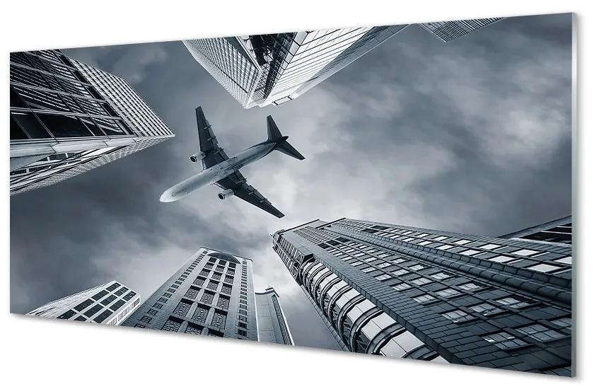 Obraz na skle Velkoměsto oblačnosti letoun nebe 125x50 cm