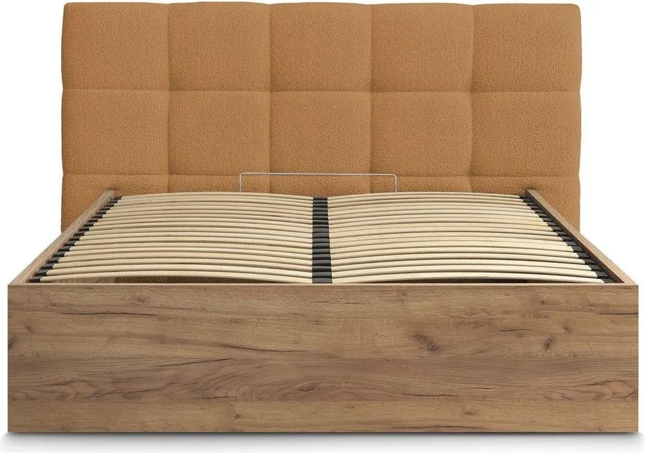 Okrově žlutá čalouněná čalouněná/z dřevotřísky dvoulůžková postel s úložným prostorem s roštem 180x200 cm Kumo – Bobochic Paris
