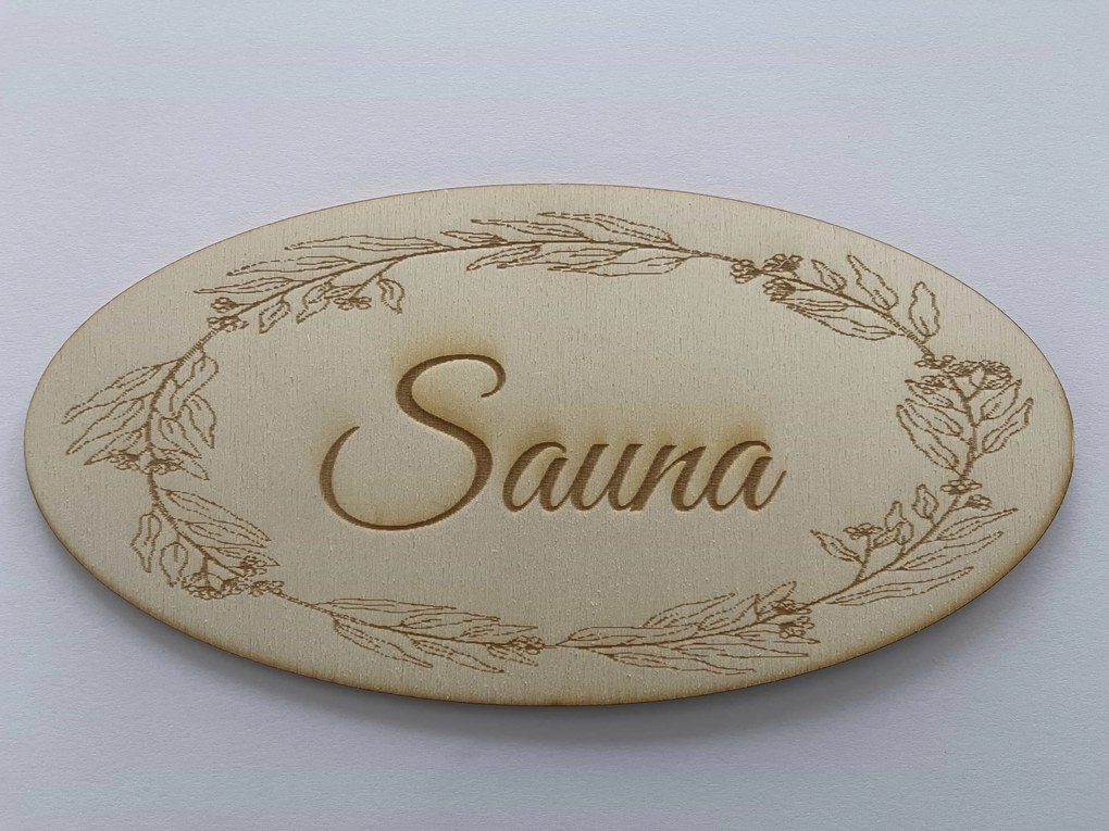 Dřevěná oválná cedule SAUNA 20 × 10 cm