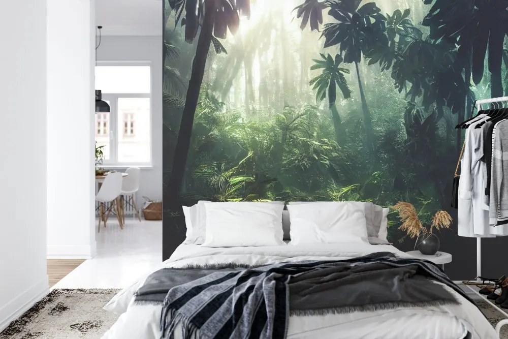 Fototapeta Dark Rainforest, Sun Rays Through The Trees, Rich Jungle Greenery. Atmospheric Fantasy Forest. 3D . Hladký vinyl 104x70.5