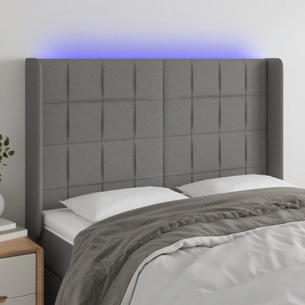 Čelo postele s LED tmavě šedé 147 x 16 x 118/128 cm textil 3124047