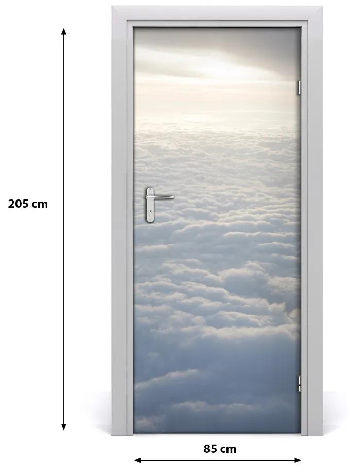 Fototapeta na dveře let nad mraky 85x205 cm