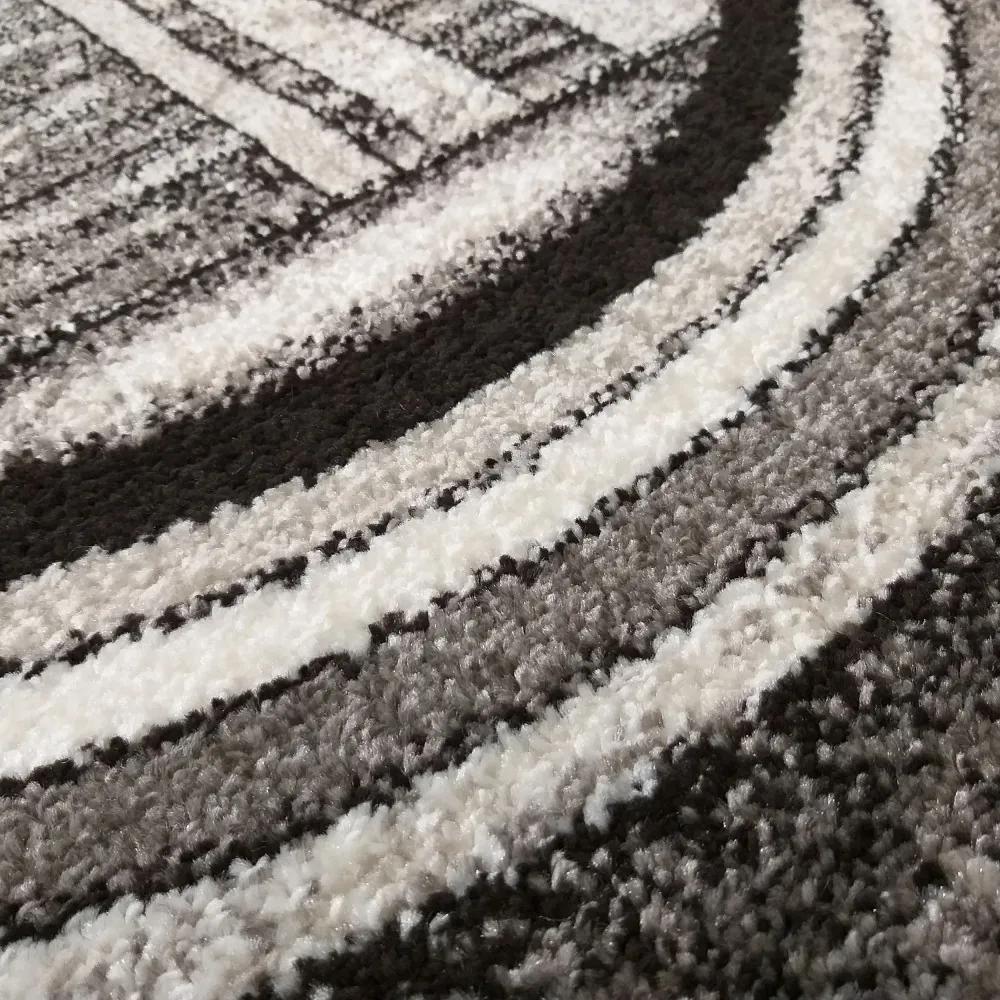 Moderní koberec s motivem kruhů šedé barvy Šířka: 120 cm | Délka: 170 cm
