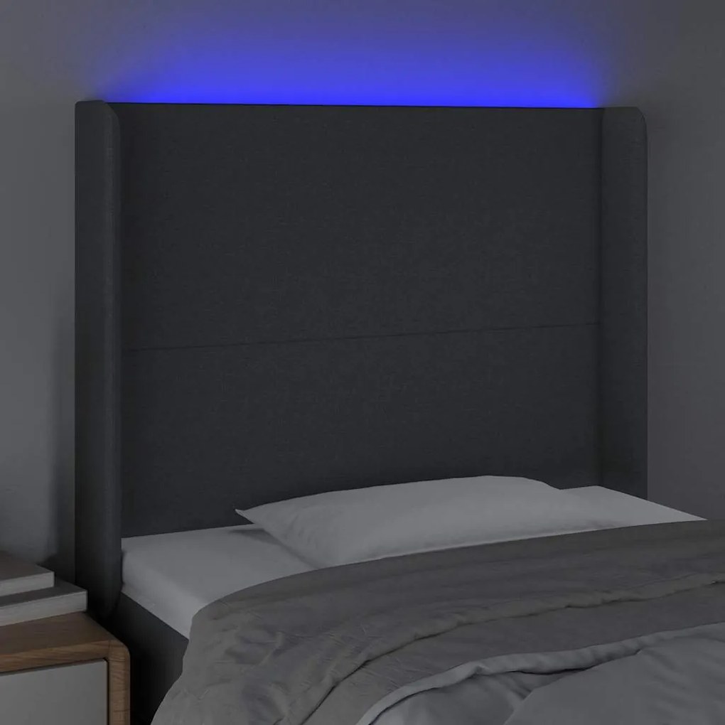 Čelo postele s LED tmavě šedé 103 x 16 x 118/128 cm textil 3123759